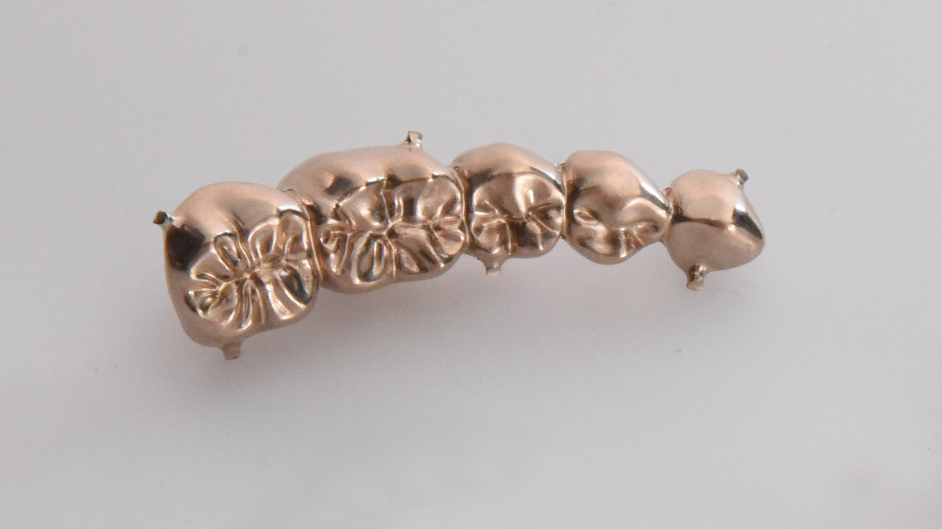 Milled gold dental restorations | Strategy Milling